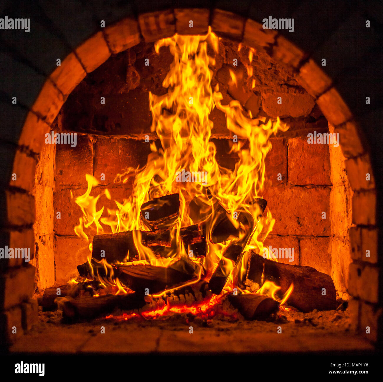 A fire burns in a fireplace Stock Photo - Alamy