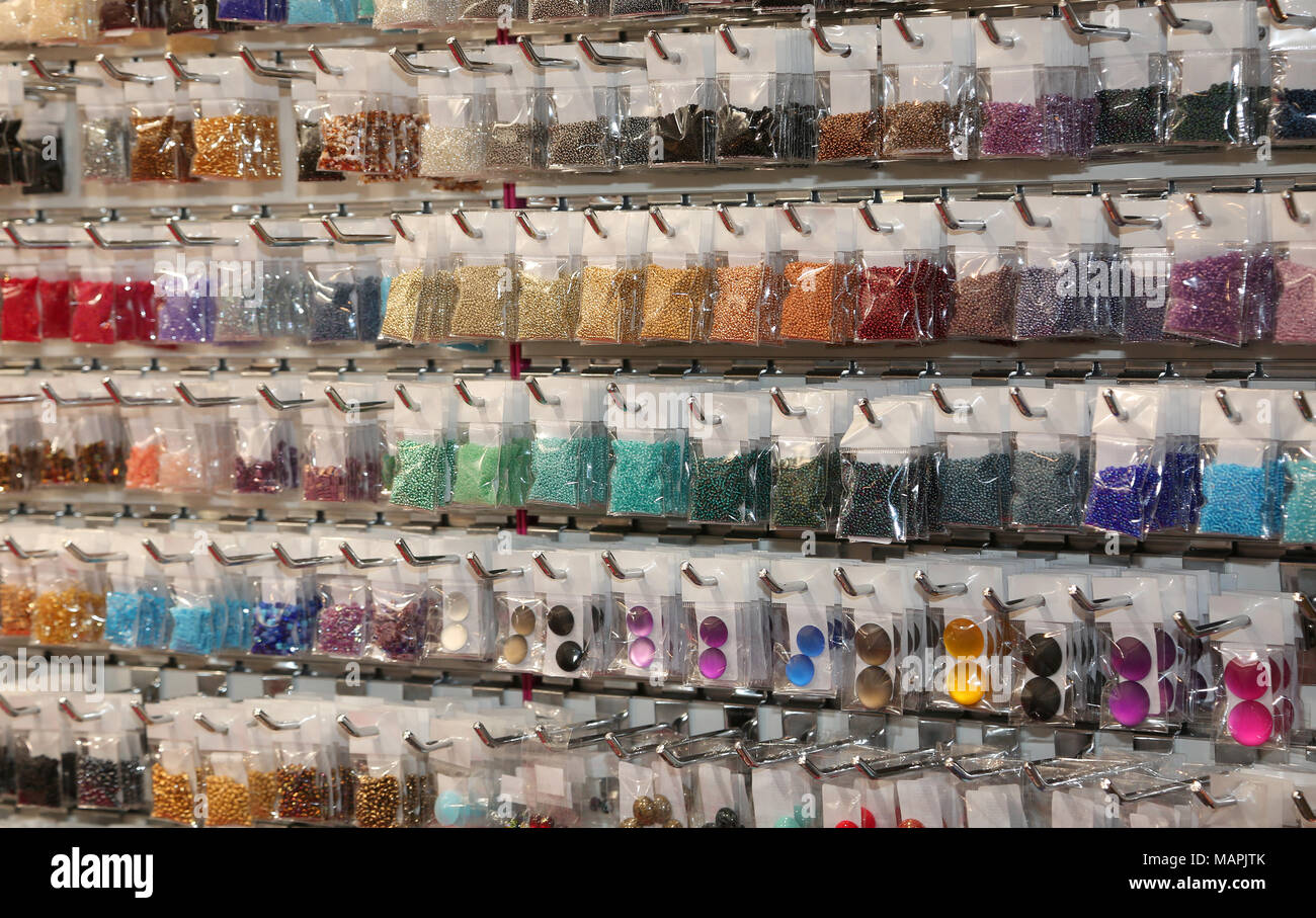 shelf with many accessories to assemble necklaces and fashion bracelets ...