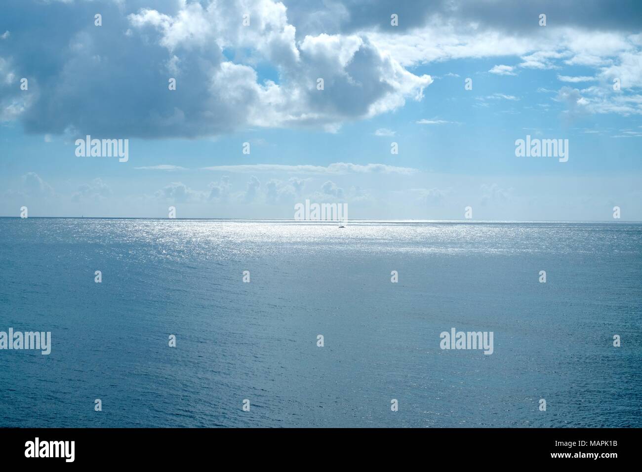 Lone sailboat on an empty ocean Stock Photo - Alamy