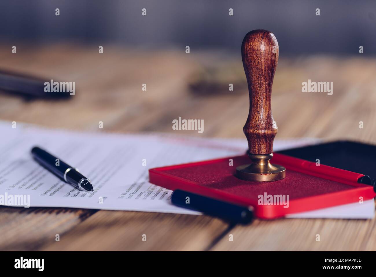 Notary public ink stamp on signed document. Law concept Stock Photo - Alamy