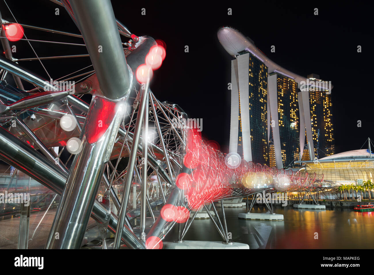The Helix bridge with Marina Bay Sands in background, Singapore Stock ...