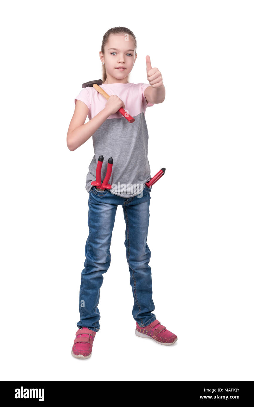 Portrait of a girl with tools in pockets and a hammer on her shoulder ...
