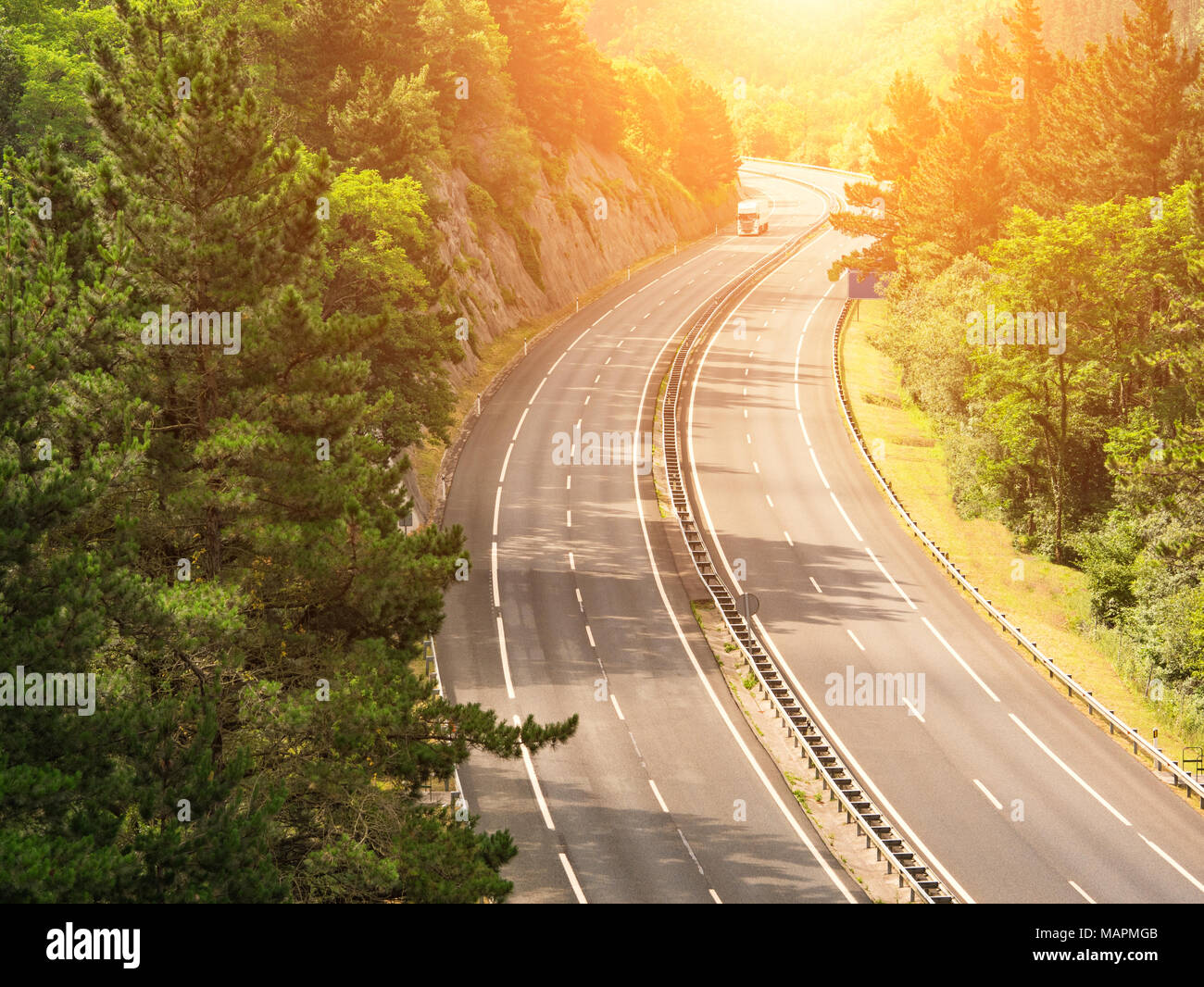 Highway across forested landscape Stock Photo - Alamy