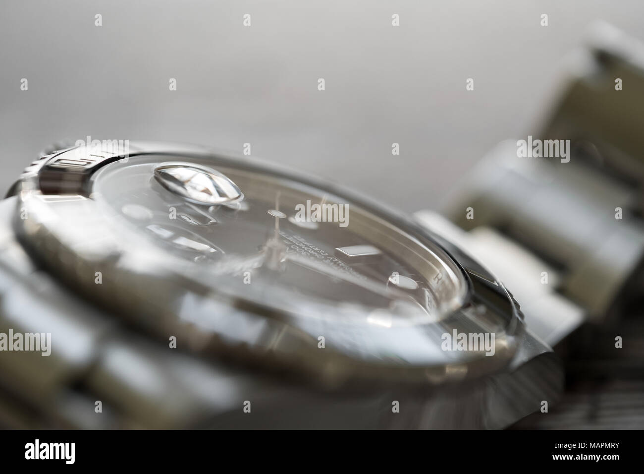 Closeup, shallow focus of an iconic, swiss-made men`s mechanical divers ...
