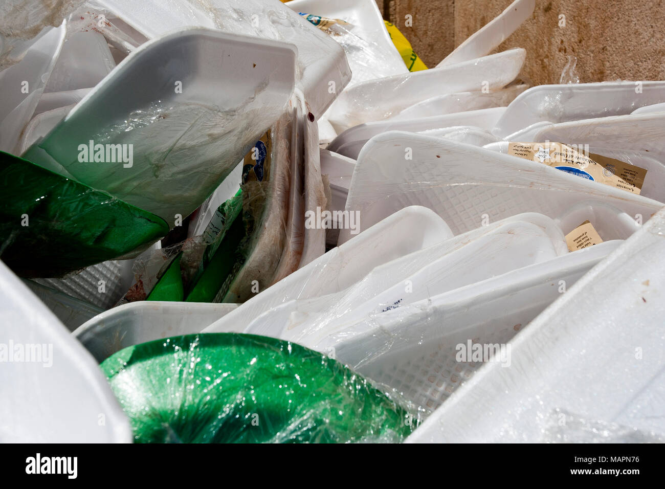 Waste plastic awaits pick up in back street of Nizwa, Oman Stock Photo ...