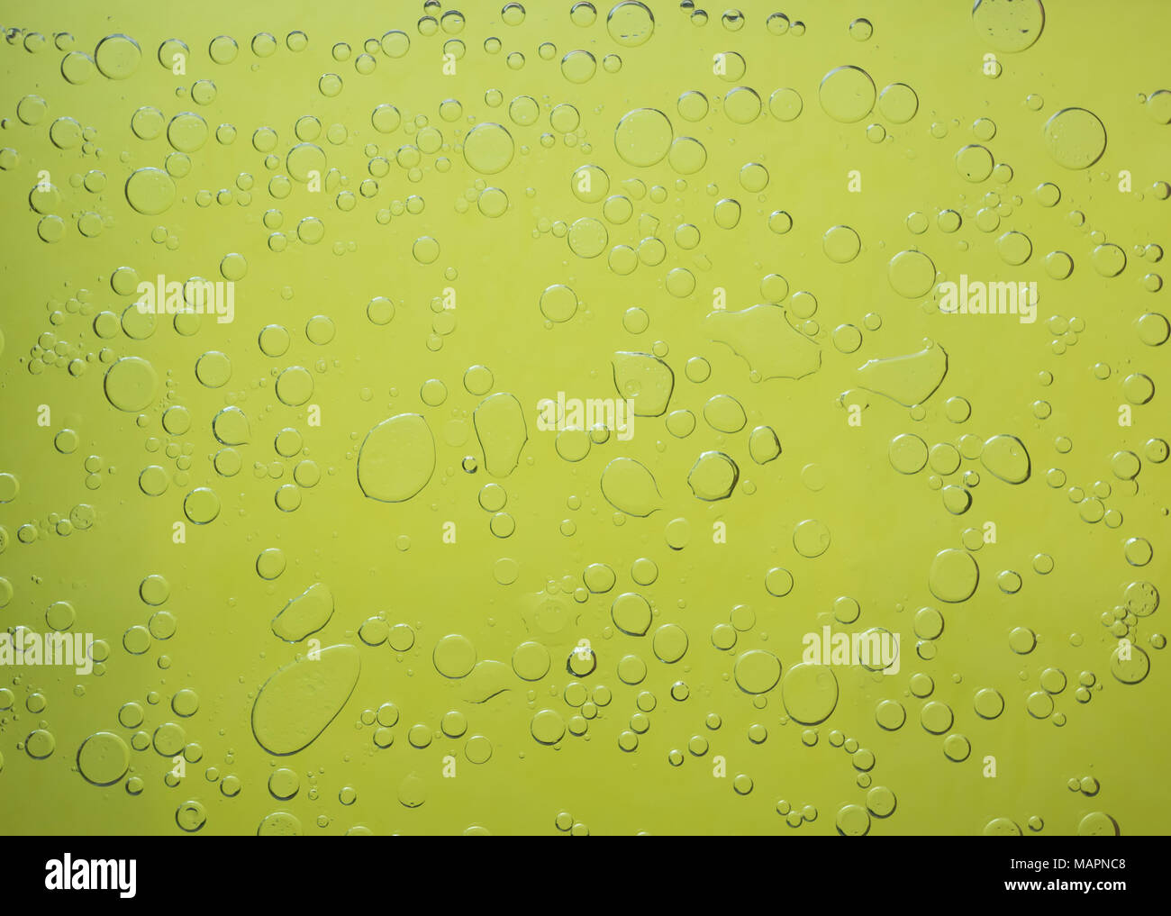 Bright yellow water droplet hi-res stock photography and images - Alamy