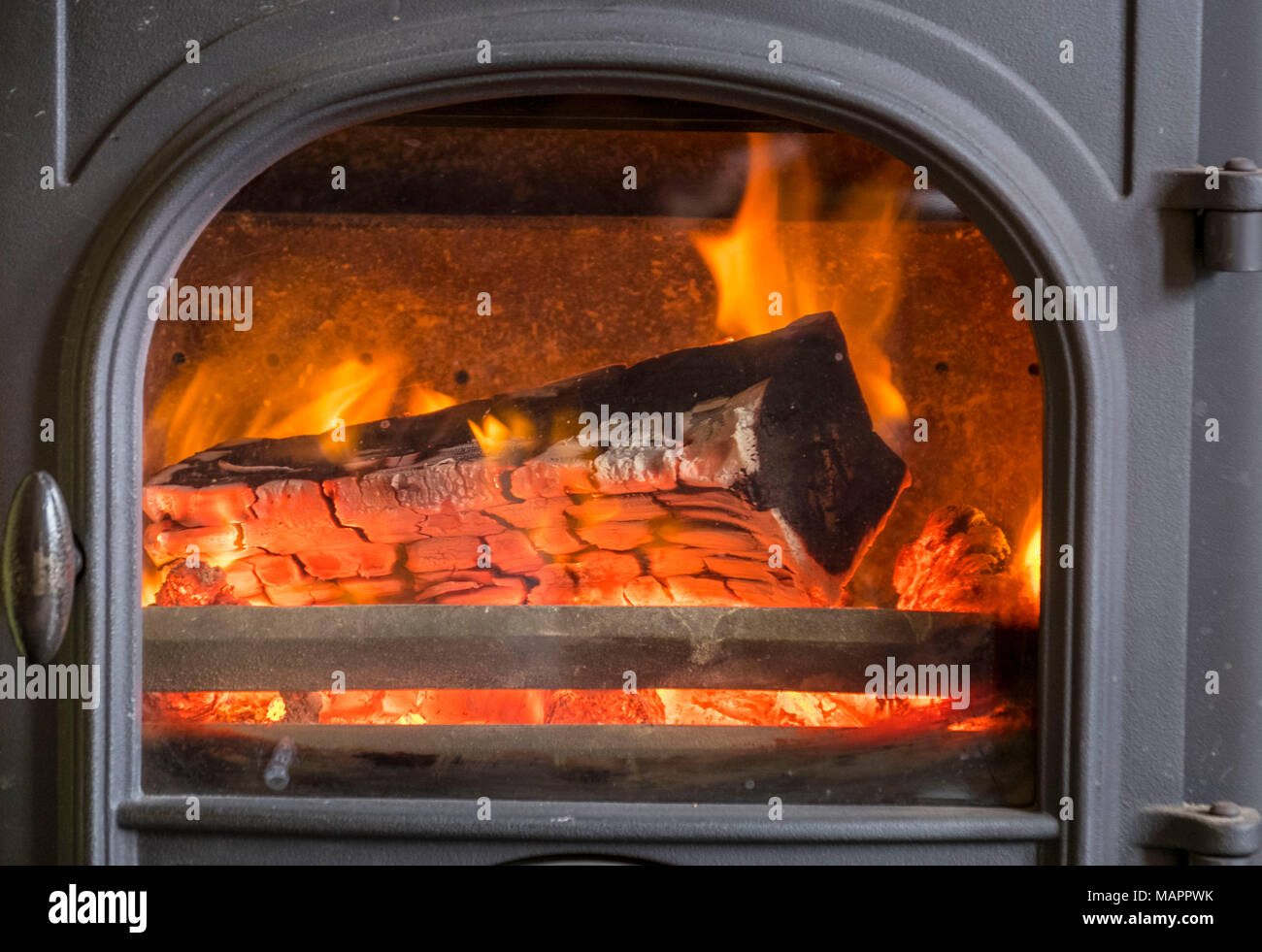 Logs burning in a log fire Stock Photo - Alamy