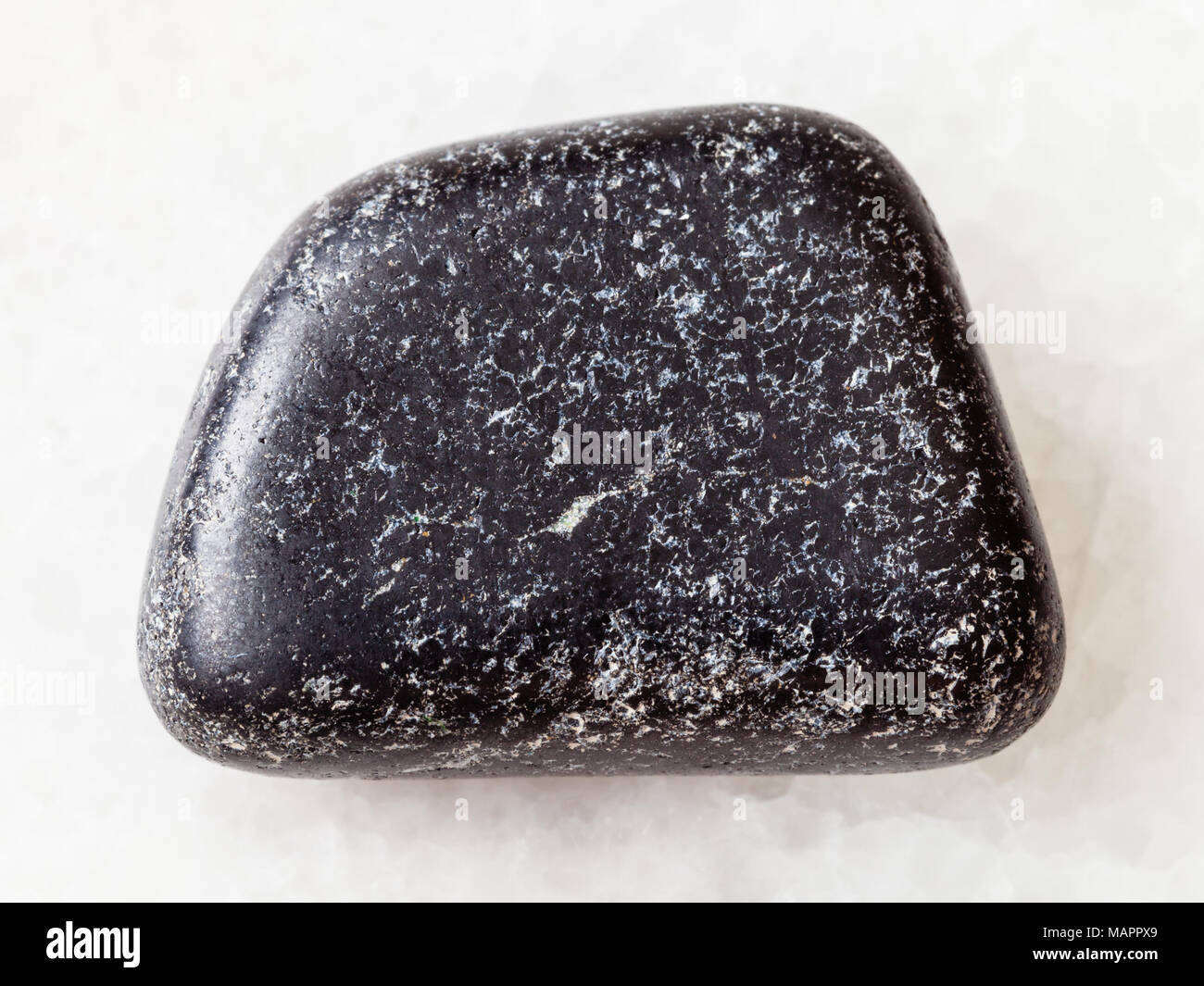 macro shooting of natural mineral rock specimen - tumbled Chromite ...