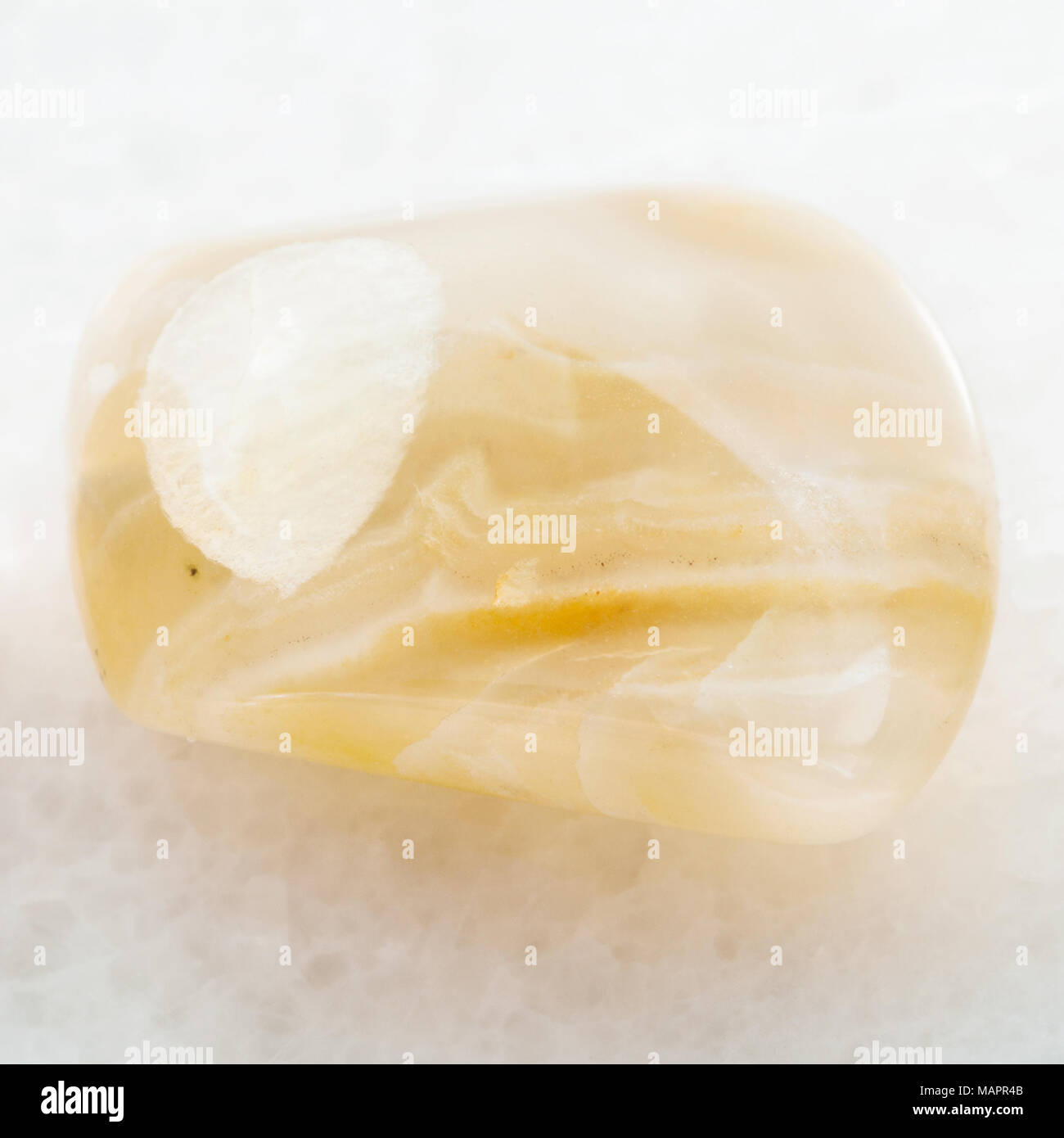 macro shooting of natural mineral rock specimen - polished yellow ...