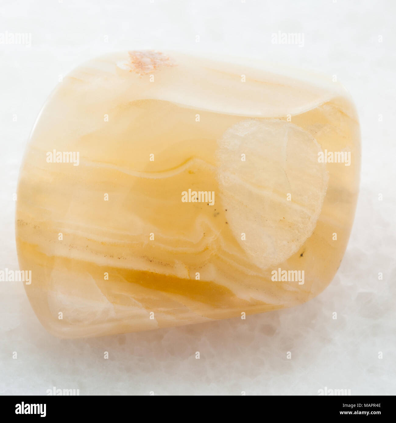 macro shooting of natural mineral rock specimen - tumbled yellow banded ...
