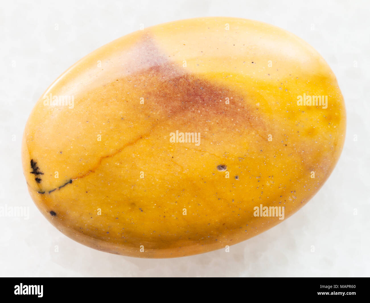 macro shooting of natural mineral rock specimen - bead from yellow ...