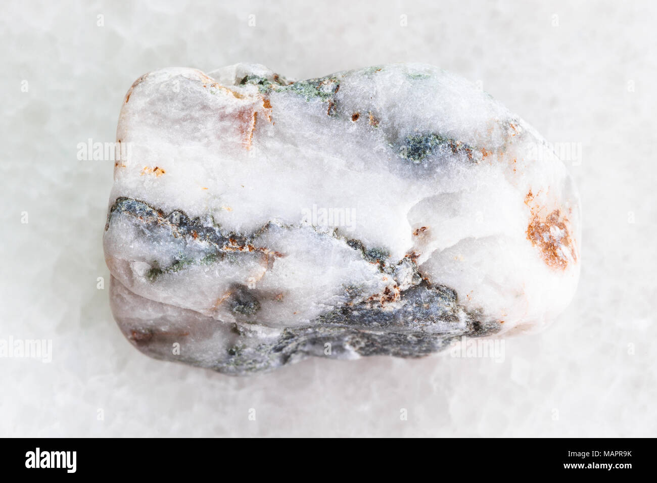 macro shooting of natural mineral rock specimen - tumbled marble piece ...