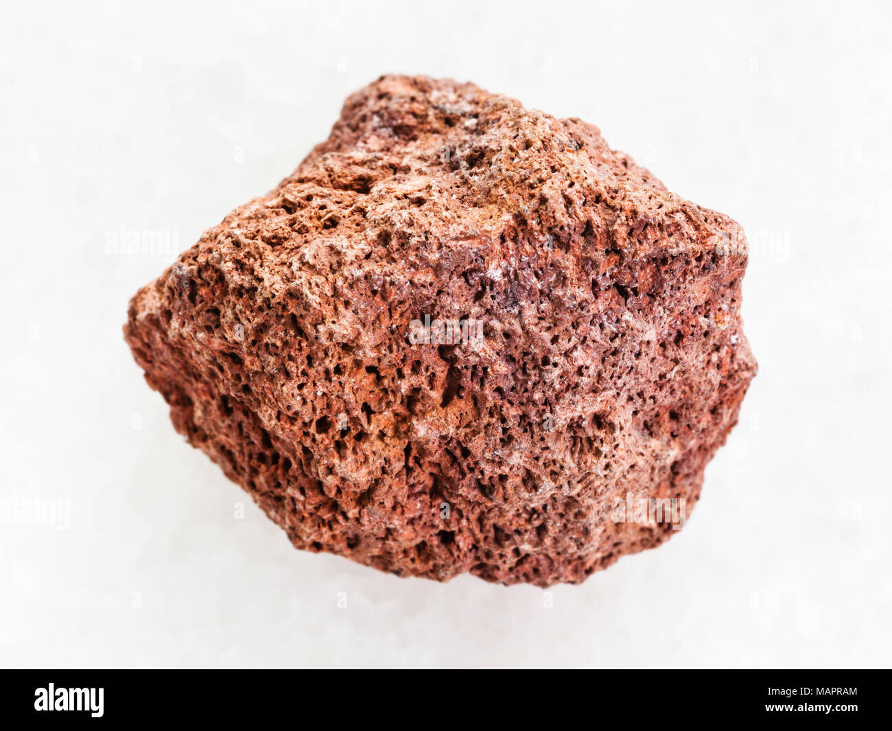macro shooting of natural mineral rock specimen - tumbled red pumice ...