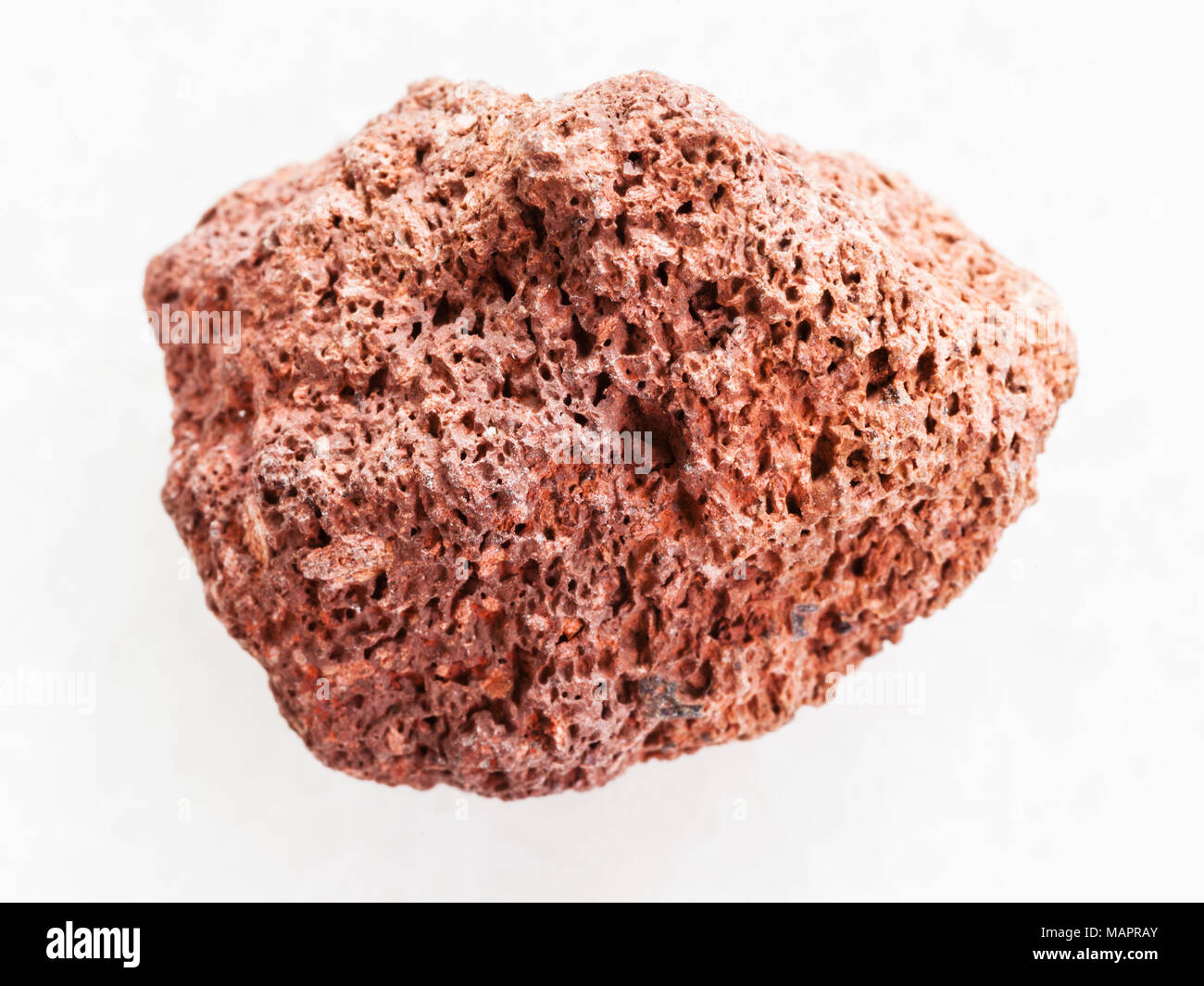 macro shooting of natural mineral rock specimen - tumbled red pumice ...