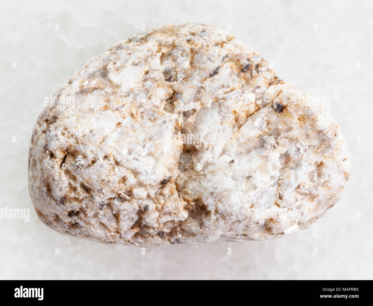 macro shooting of natural mineral rock specimen - white Granite stone ...