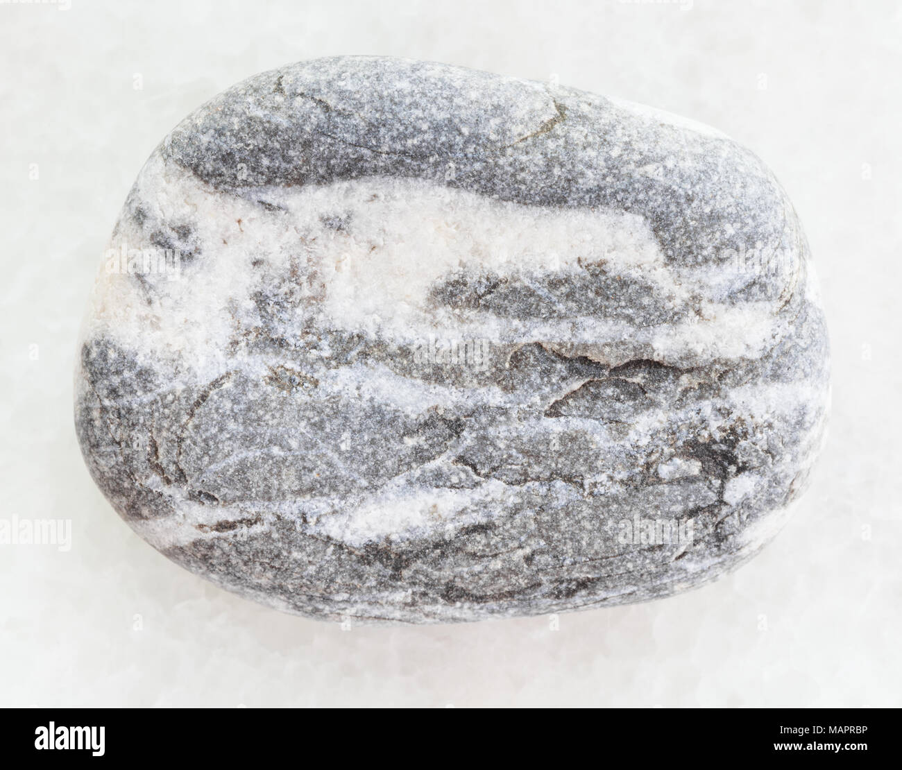 macro shooting of natural mineral rock specimen - tumbled gray Gneiss ...