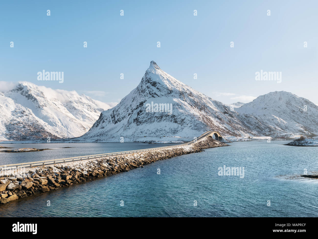 Mountain peak and bridge on the lake. Natural landscape in the Norway ...