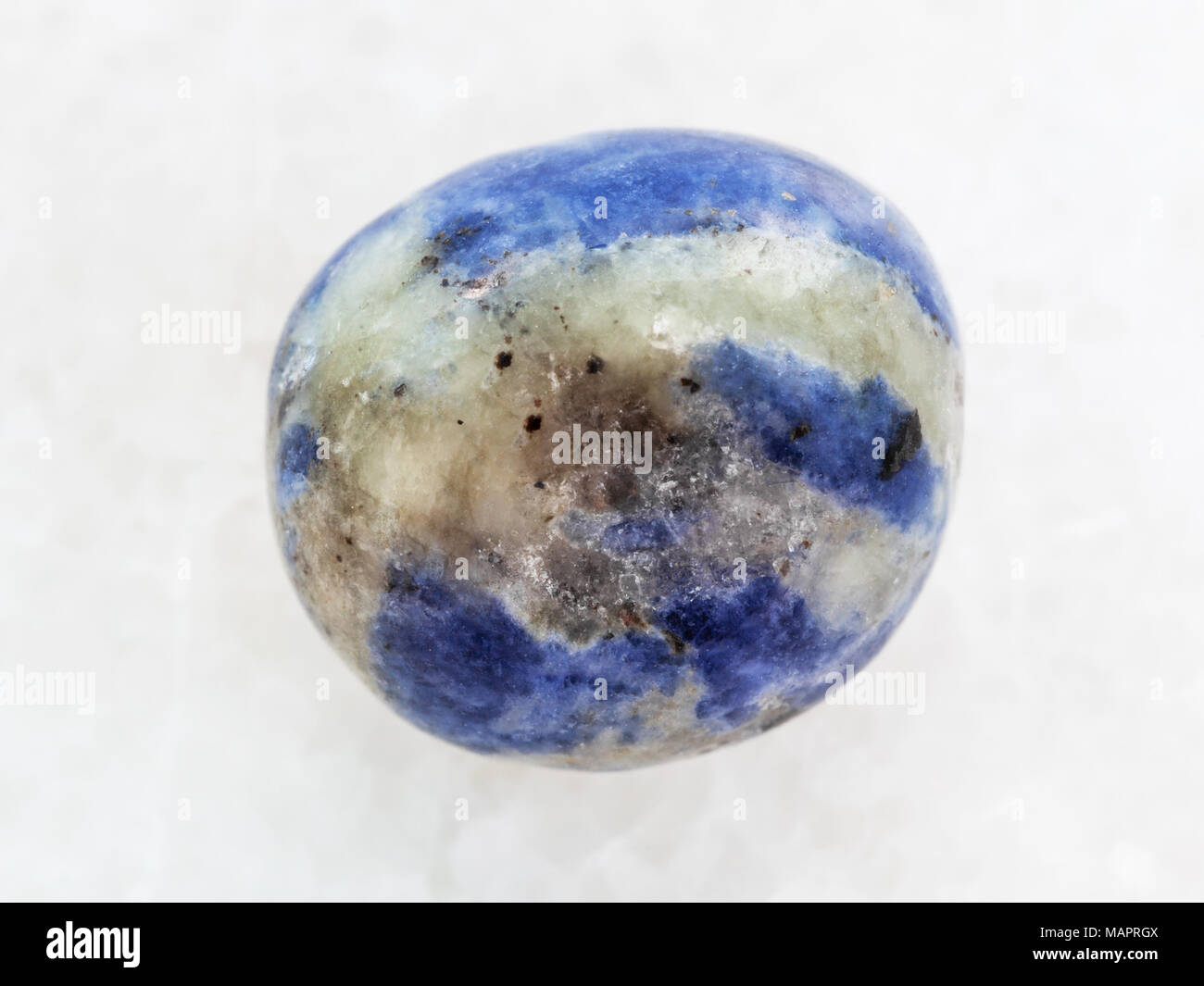 macro shooting of natural mineral rock specimen - polished Sodalite gem ...