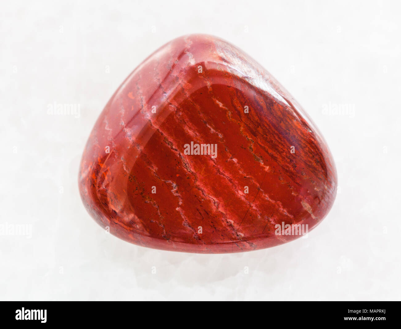 macro shooting of natural mineral rock specimen - polished red jasper ...