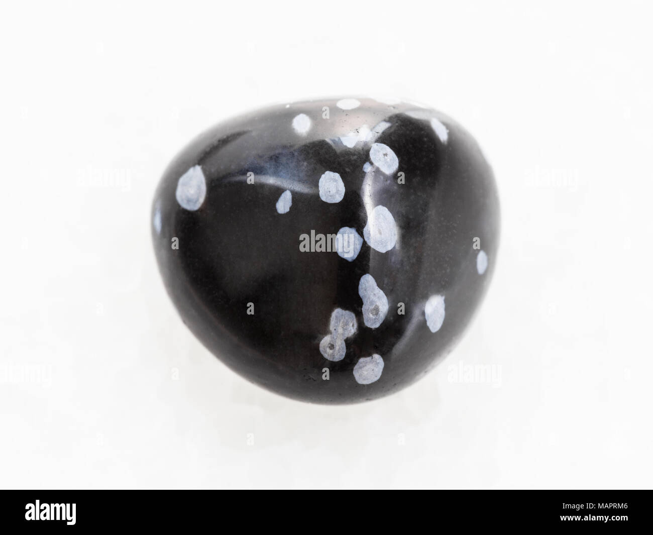 macro shooting of natural mineral rock specimen - tumbled snowflake ...