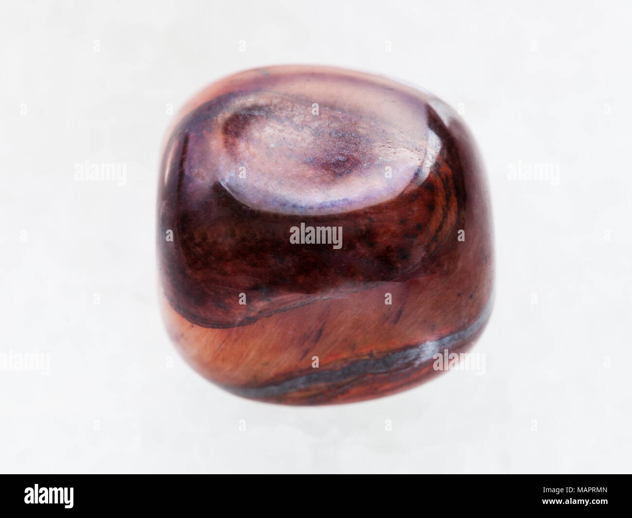 macro shooting of natural mineral rock specimen - tumbled jaspilite gem ...