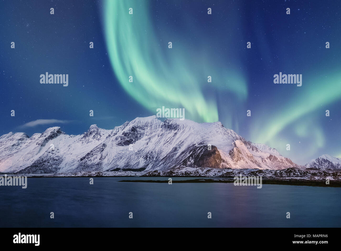 Northen light under mountains. Beautiful natural landscape in the ...