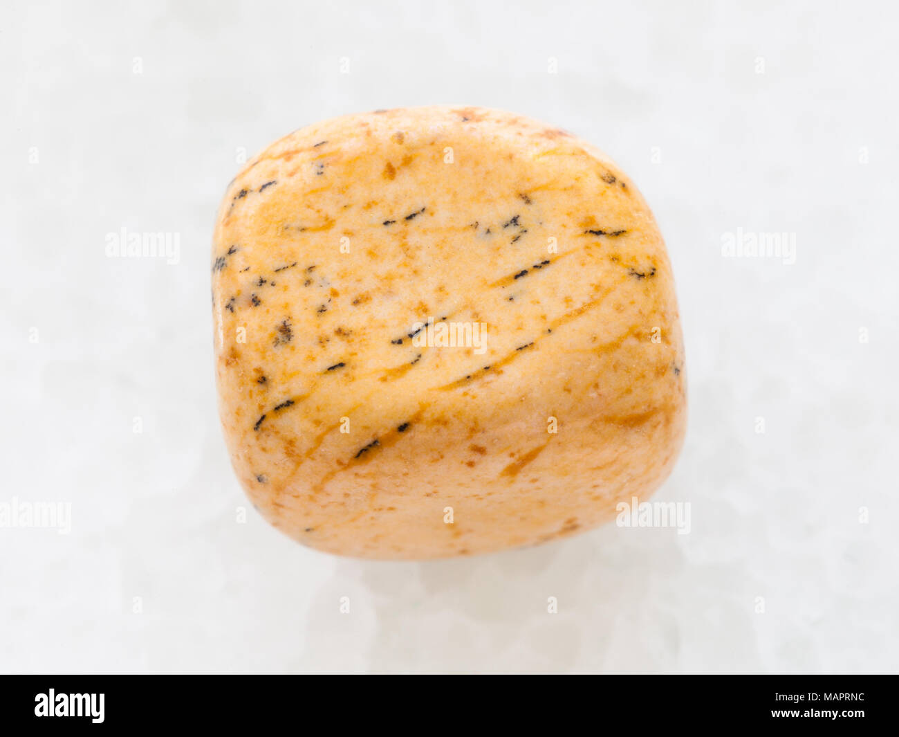 macro shooting of natural mineral rock specimen - tumbled sandy Jasper ...