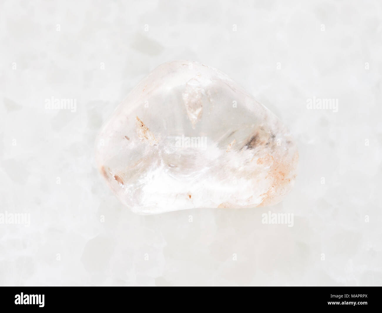 macro shooting of natural mineral rock specimen - tumbled rock crystal ...