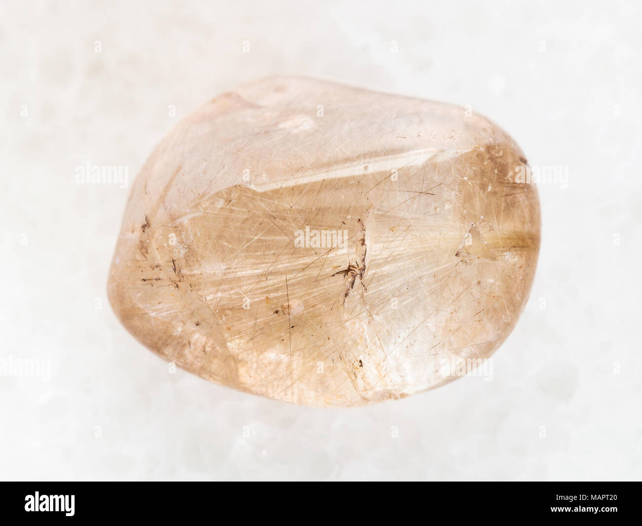 macro shooting of natural mineral rock specimen - tumbled Rutilated ...