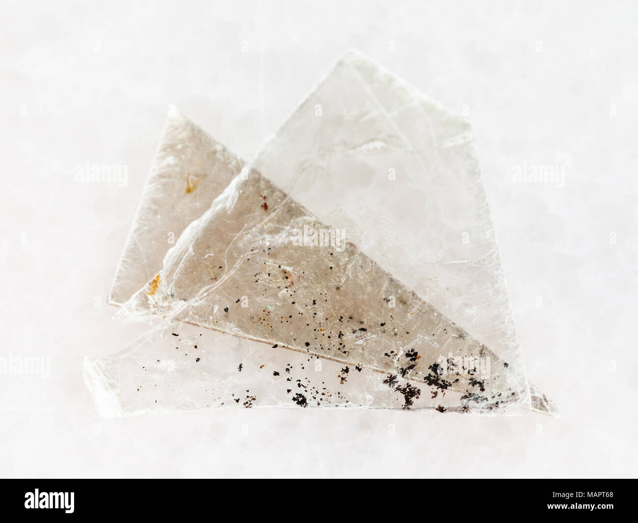 macro shooting of natural mineral rock specimen - raw muscovite mica ...