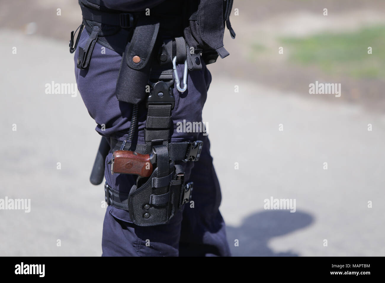 Details of the security kit of a police officer Stock Photo - Alamy