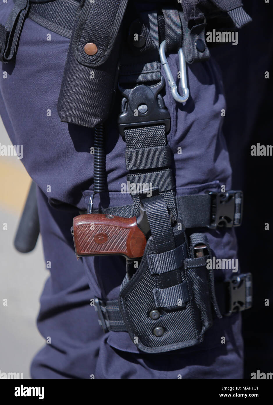 Details of the security kit of a police officer Stock Photo - Alamy