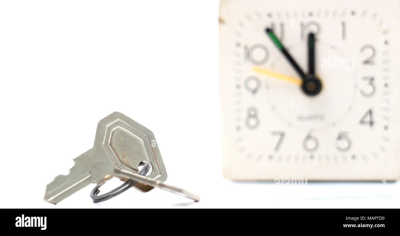 picture of a keys in front of vintage alarm clock Stock Photo - Alamy