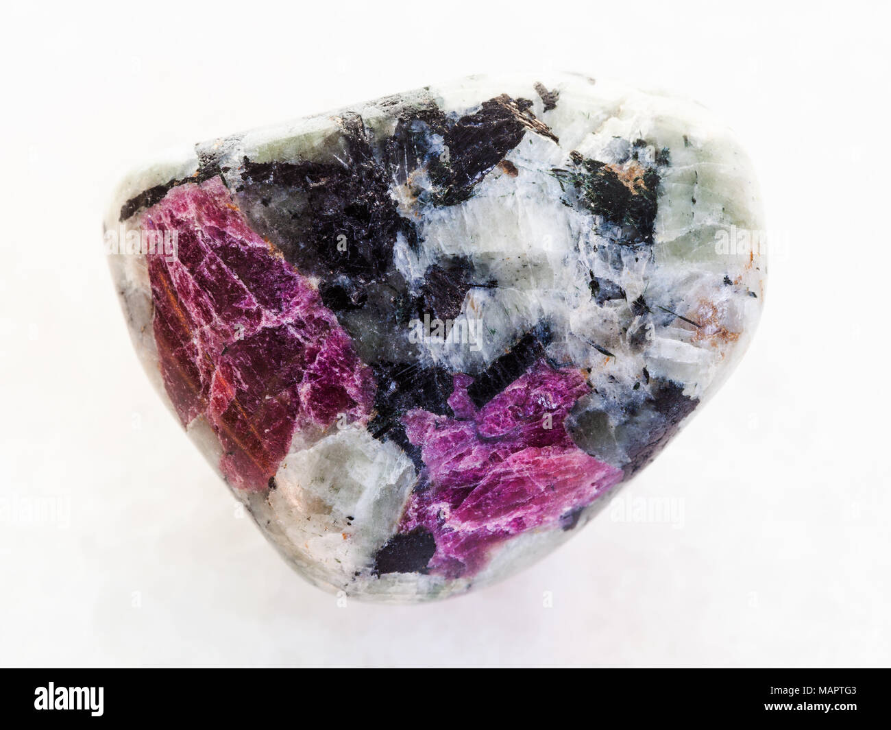 macro shooting of natural mineral stone specimen - tumbled pink ...