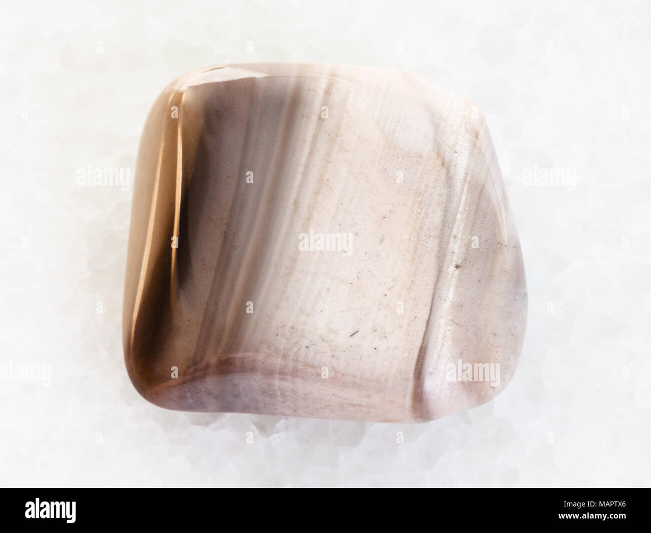 macro shooting of natural mineral rock specimen - polished flint stone ...