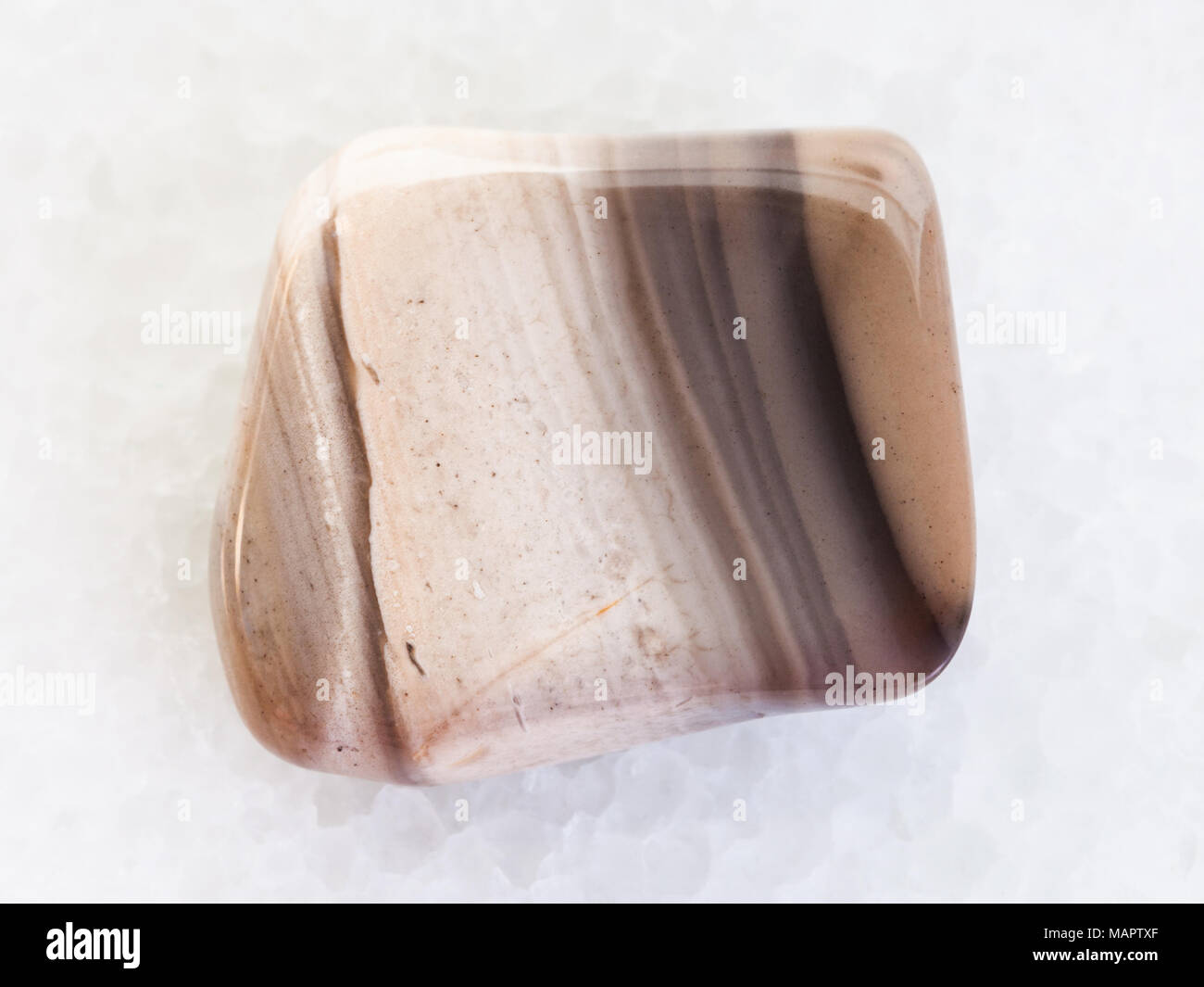 macro shooting of natural mineral rock specimen - tumbled flint stone ...