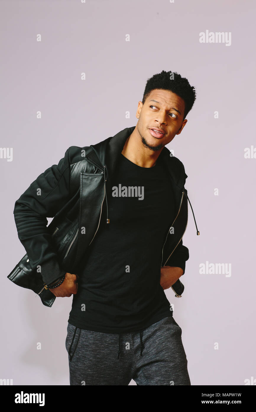 Portrait of a cool young man, isolated on studio background Stock Photo ...