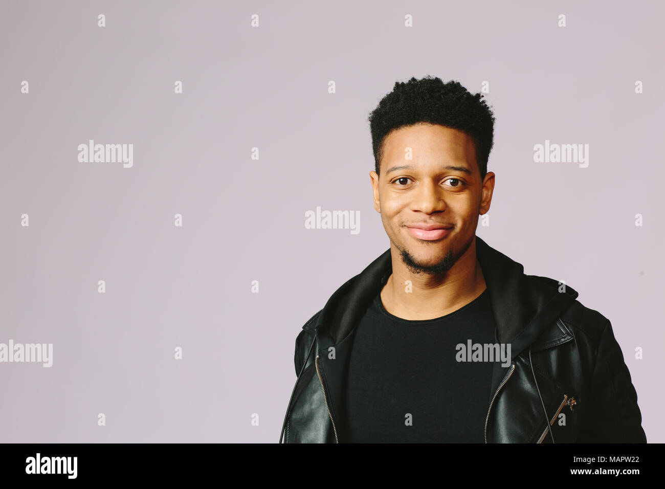 Portrait of a cool young man, isolated on studio background Stock Photo ...