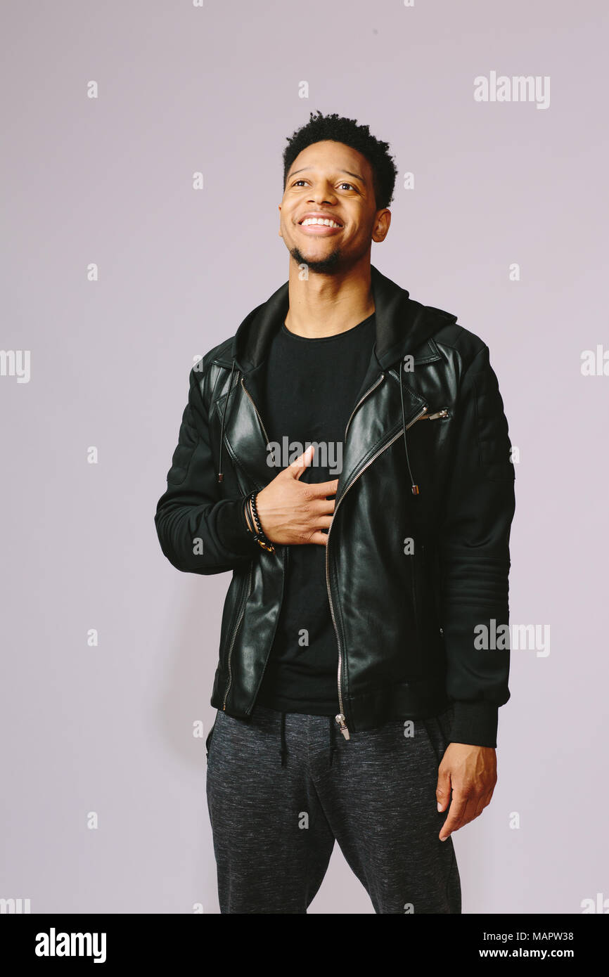 Portrait of a cool young man, isolated on studio background Stock Photo ...