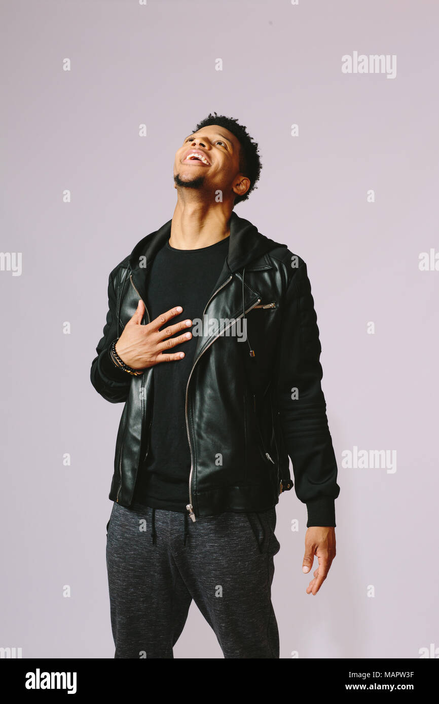 Portrait of a cool young man, isolated on studio background Stock Photo ...