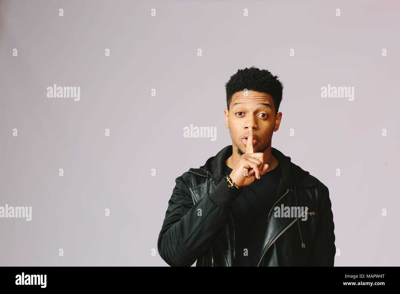 Portrait of a cool young man, isolated on studio background Stock Photo ...