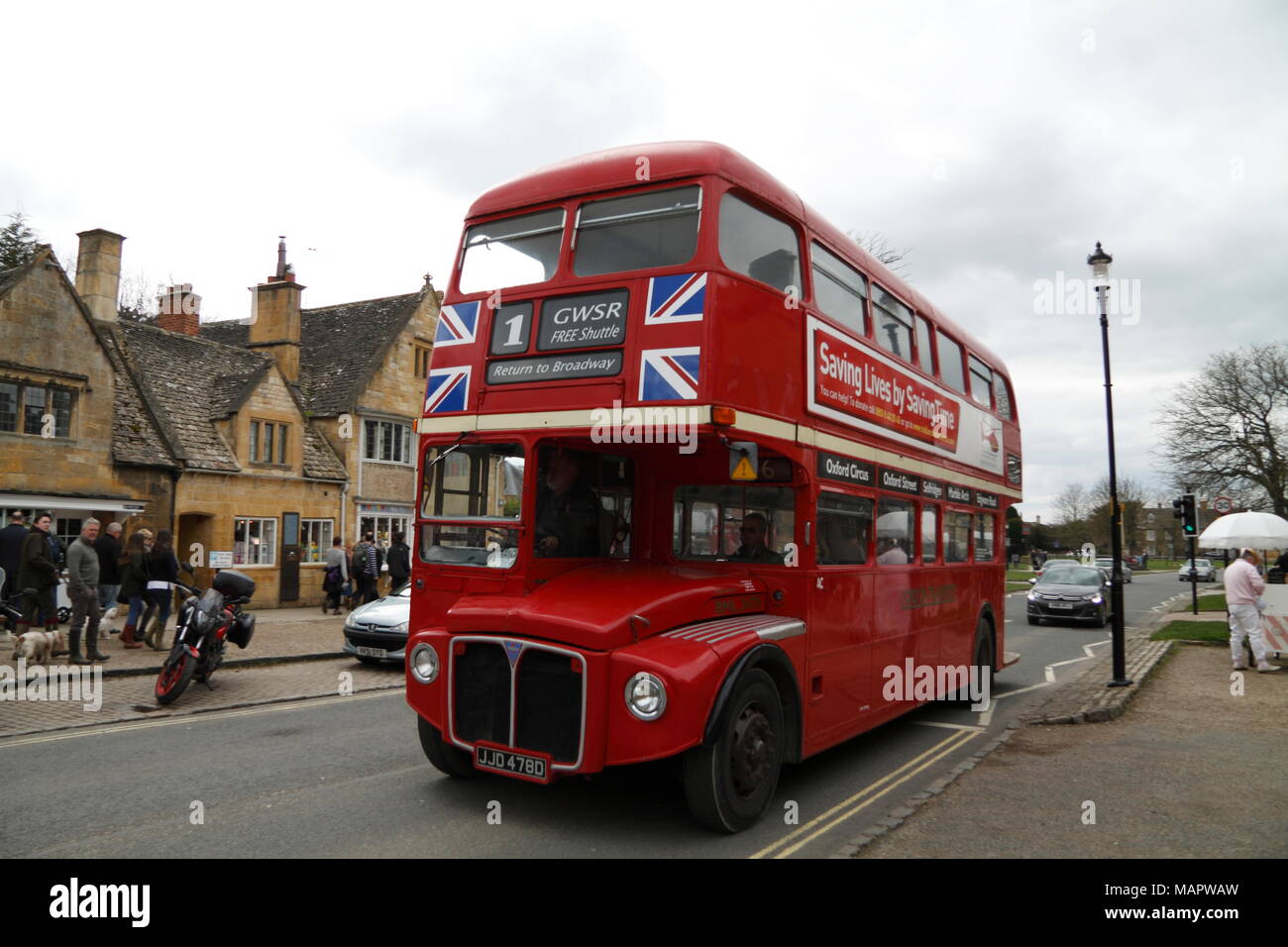 Train Shuttle Bus travelling through Broadway Stock Photo - Alamy