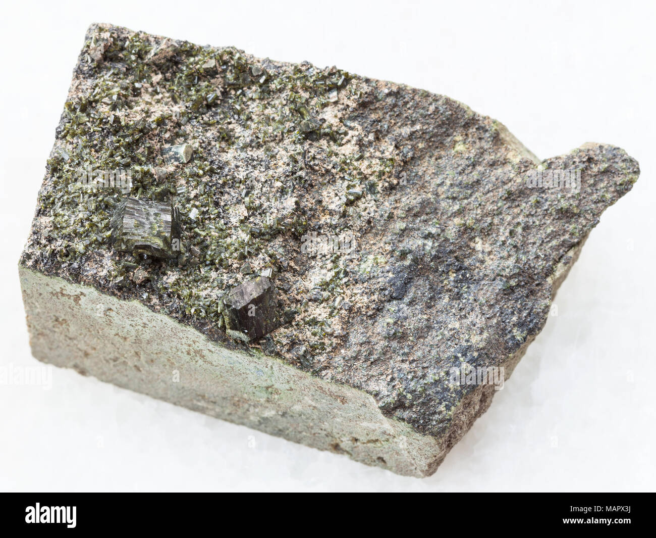 macro shooting of natural mineral stone specimen - rough green crystals ...