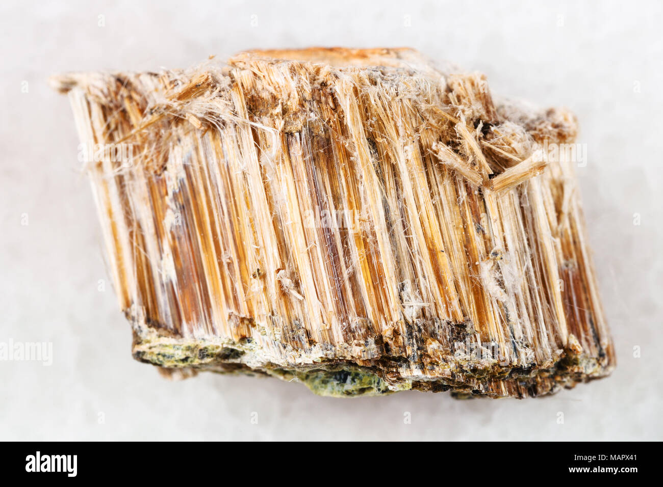 macro shooting of natural mineral rock specimen - rough brown asbestos ...