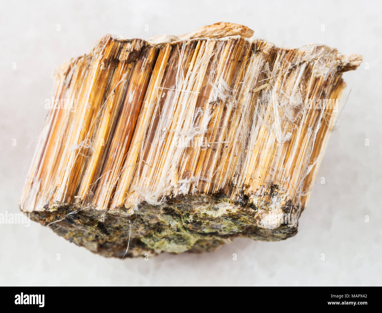 macro shooting of natural mineral rock specimen - raw brown asbestos ...