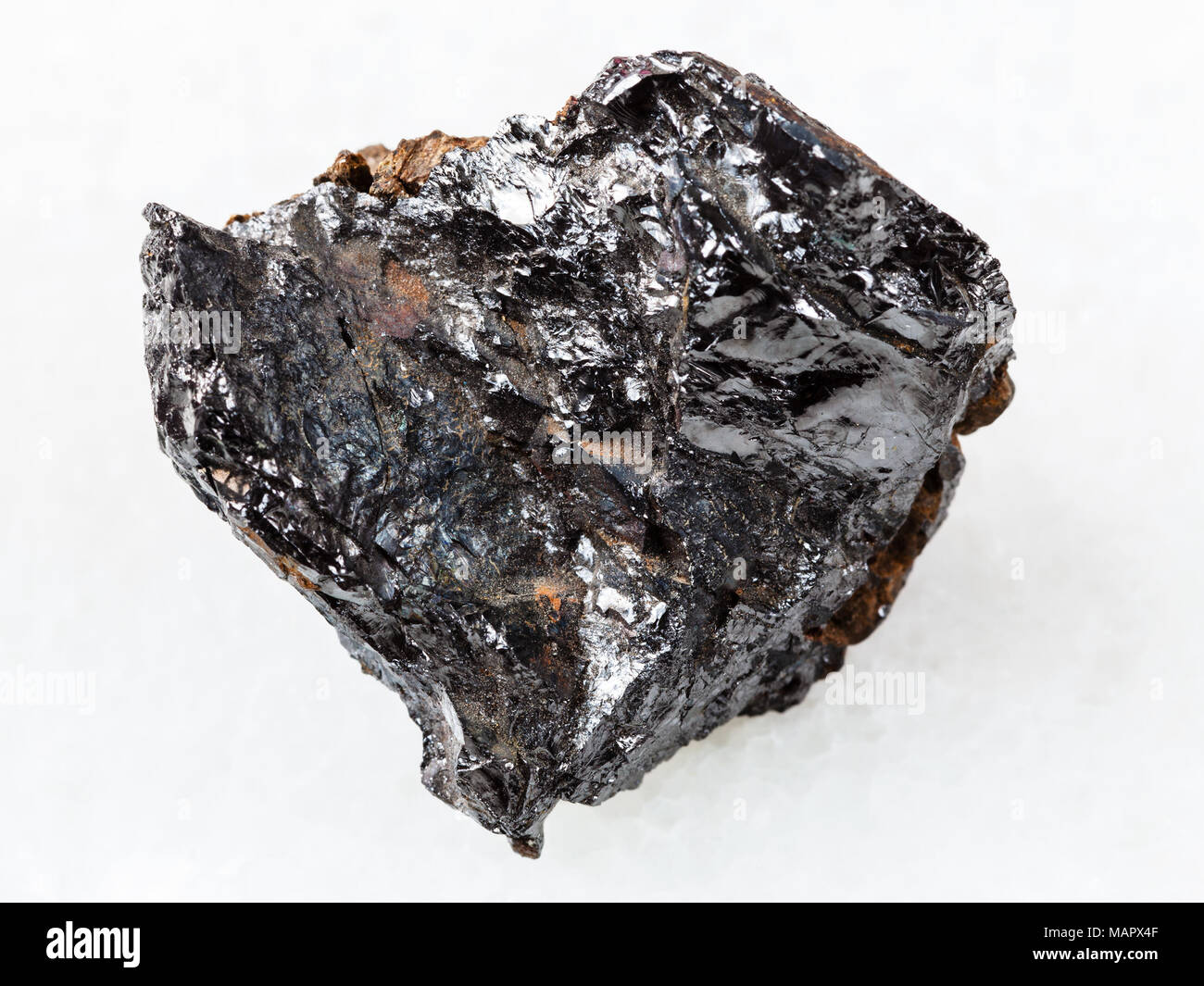 macro shooting of natural mineral rock specimen - raw ilmenorutile (Nb ...