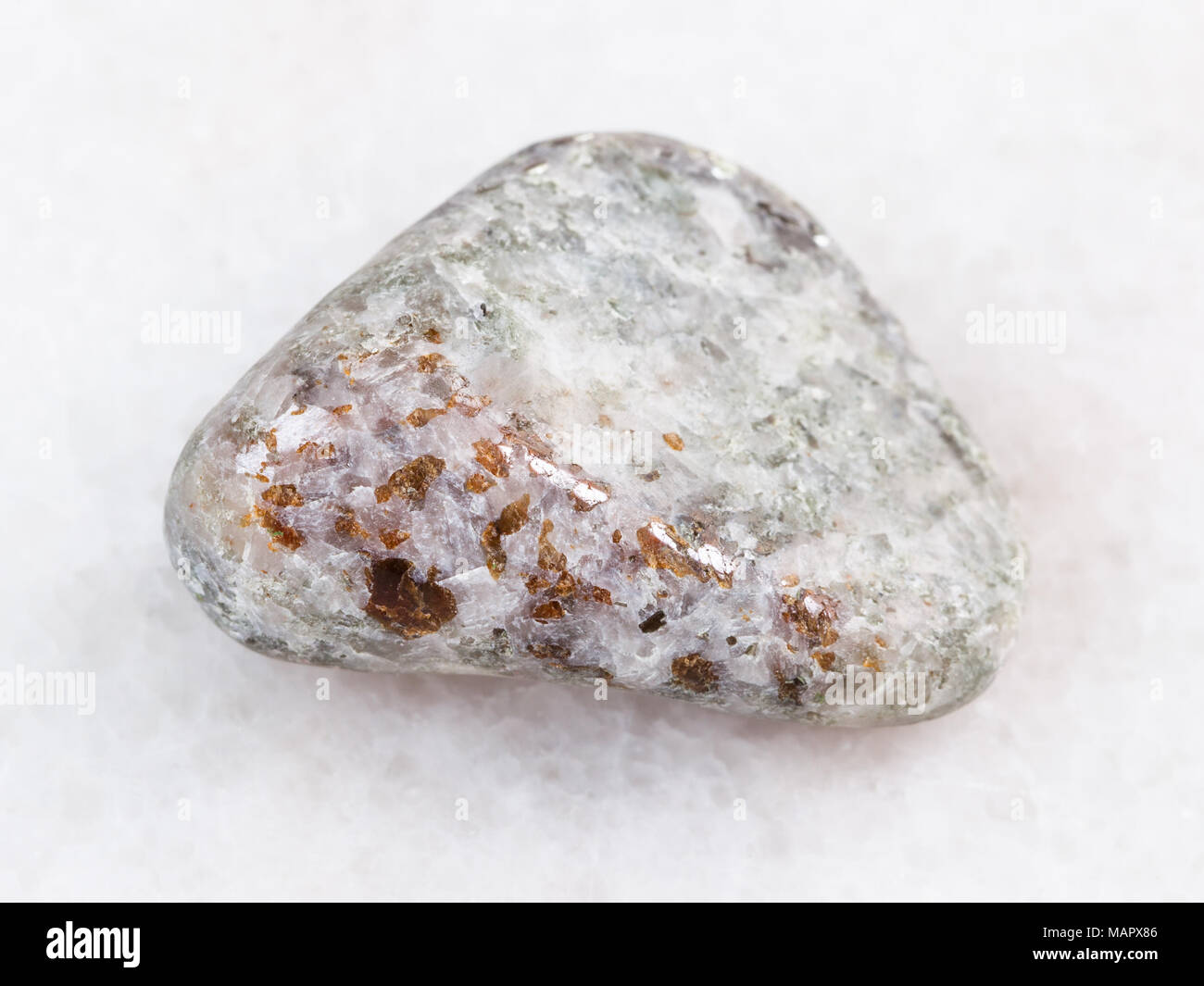 macro shooting of natural mineral rock specimen - brown chondrodite ...