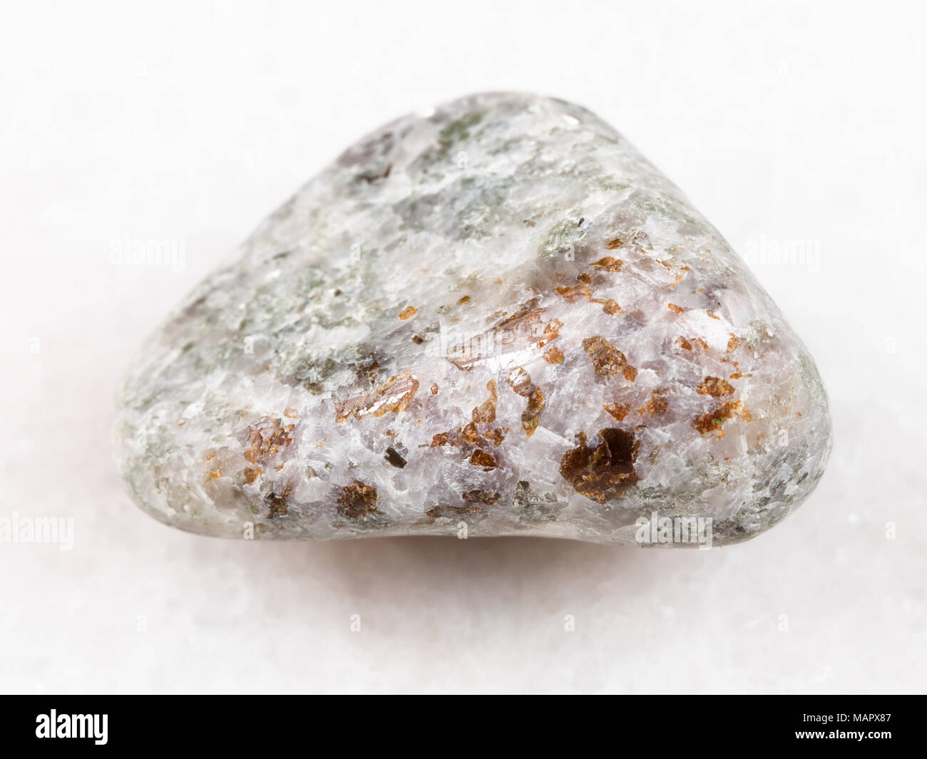 macro shooting of natural mineral rock specimen - brown chondrodite ...