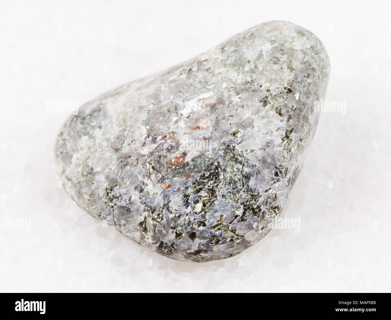 macro shooting of natural mineral rock specimen - tumbled calcite stone ...