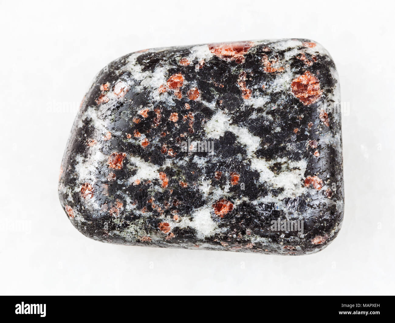 macro shooting of natural mineral rock specimen - red Garnet crystals ...